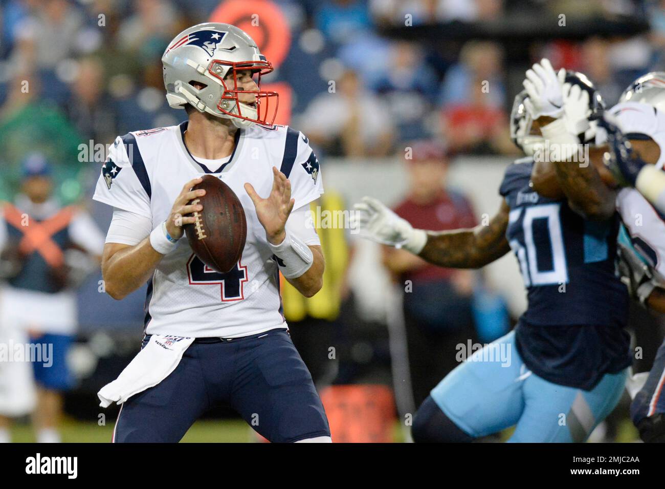 New England Patriots quarterback Jarrett Stidham (4) passes against the Tennessee Titans in the ...