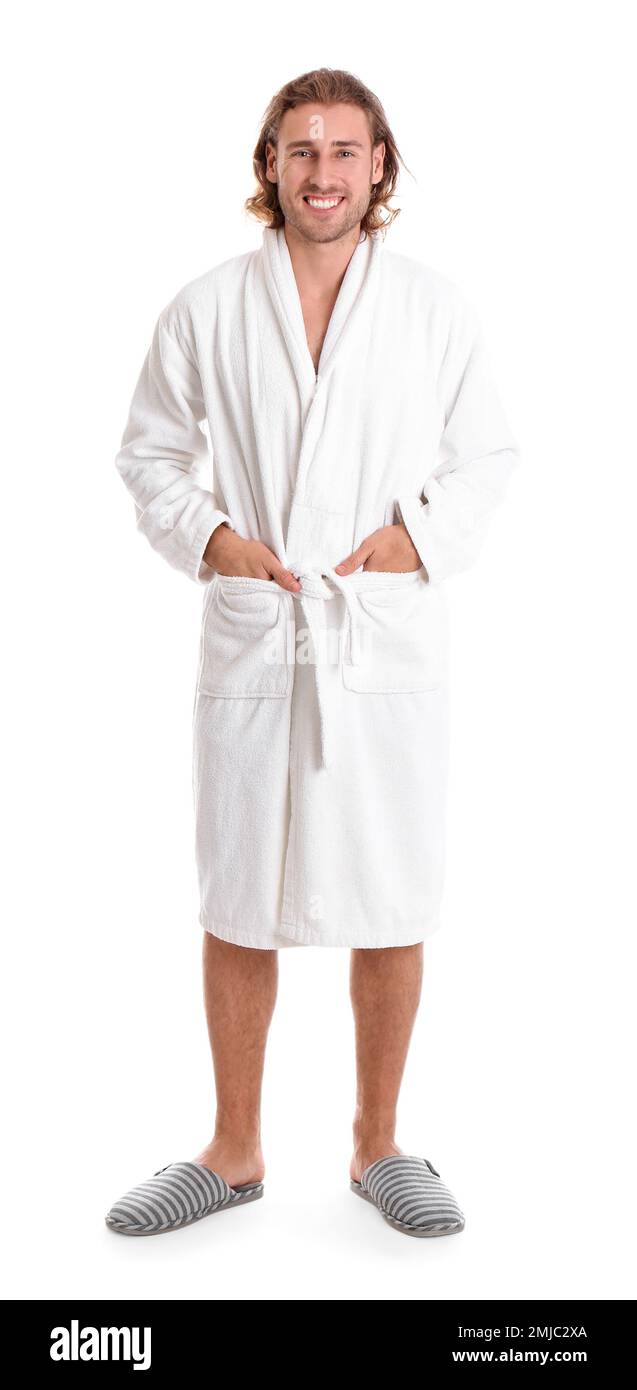Young man in bathrobe on white background Stock Photo - Alamy