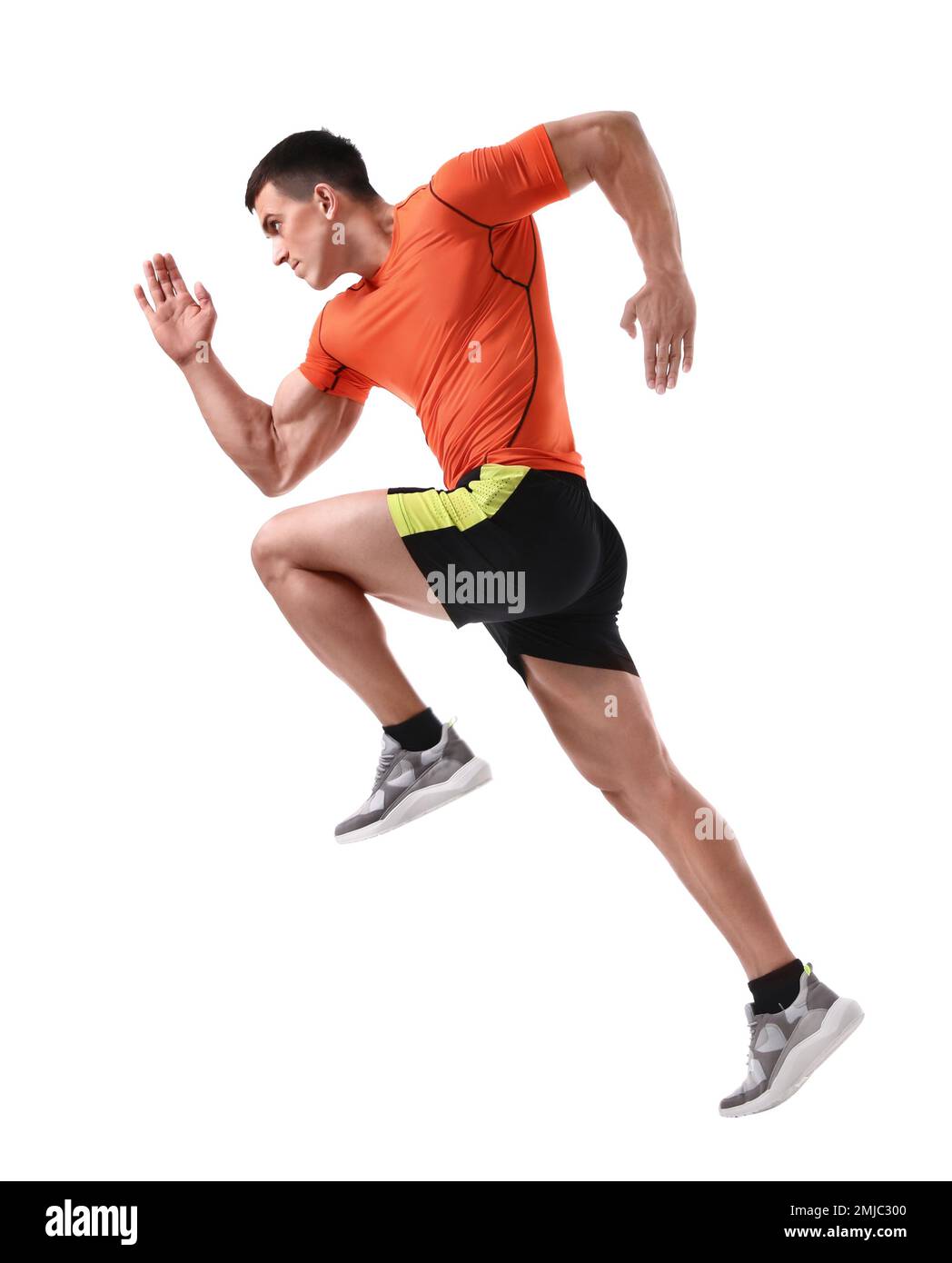 Athletic young man running on white background, side view Stock Photo - Alamy
