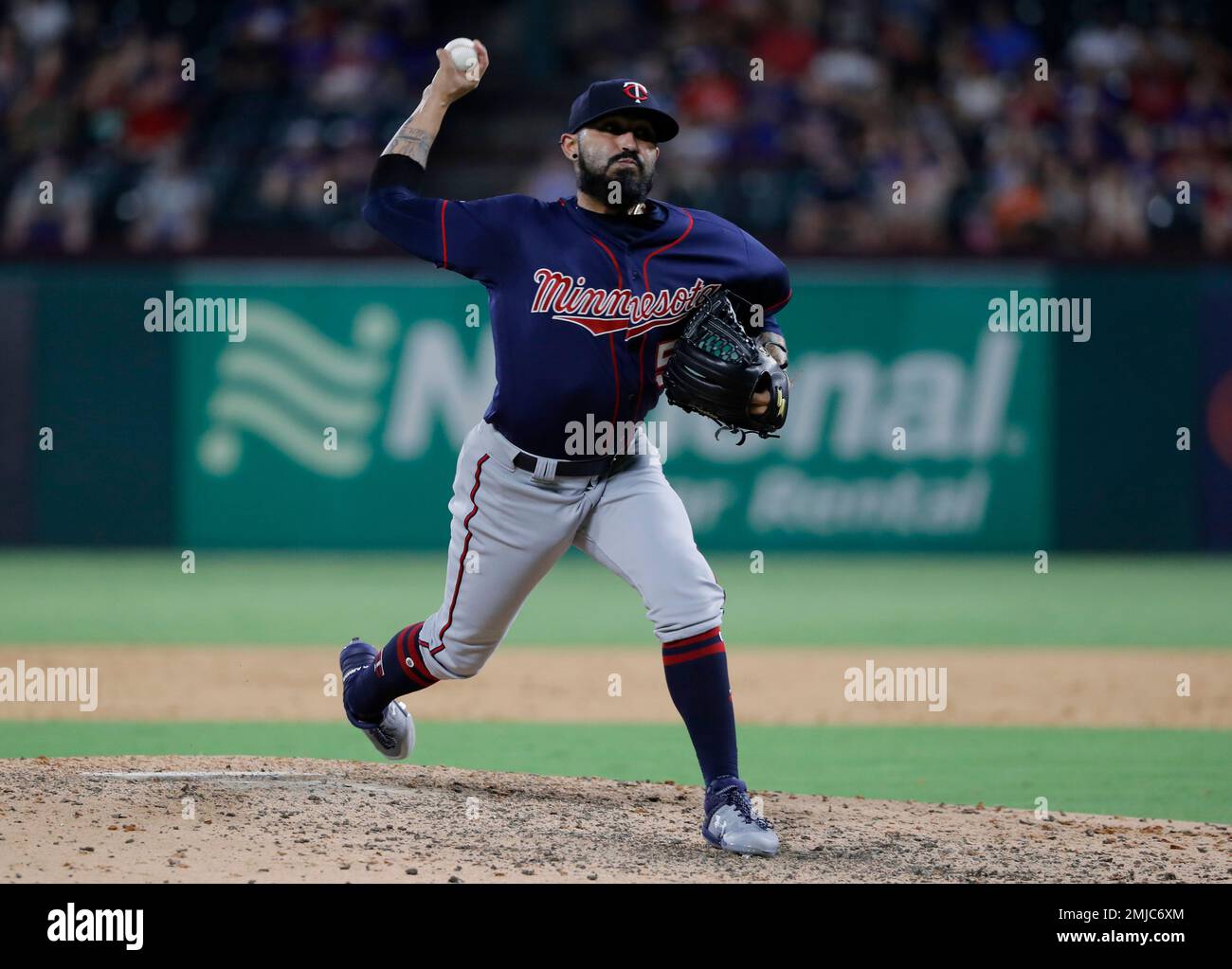 Minnesota Twins relief pitcher Sergio Romo throws to the Texas Rangers ...