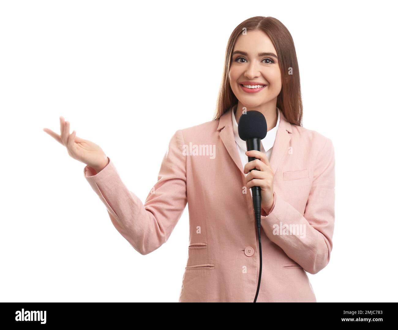Young female journalist with microphone on white background Stock Photo ...