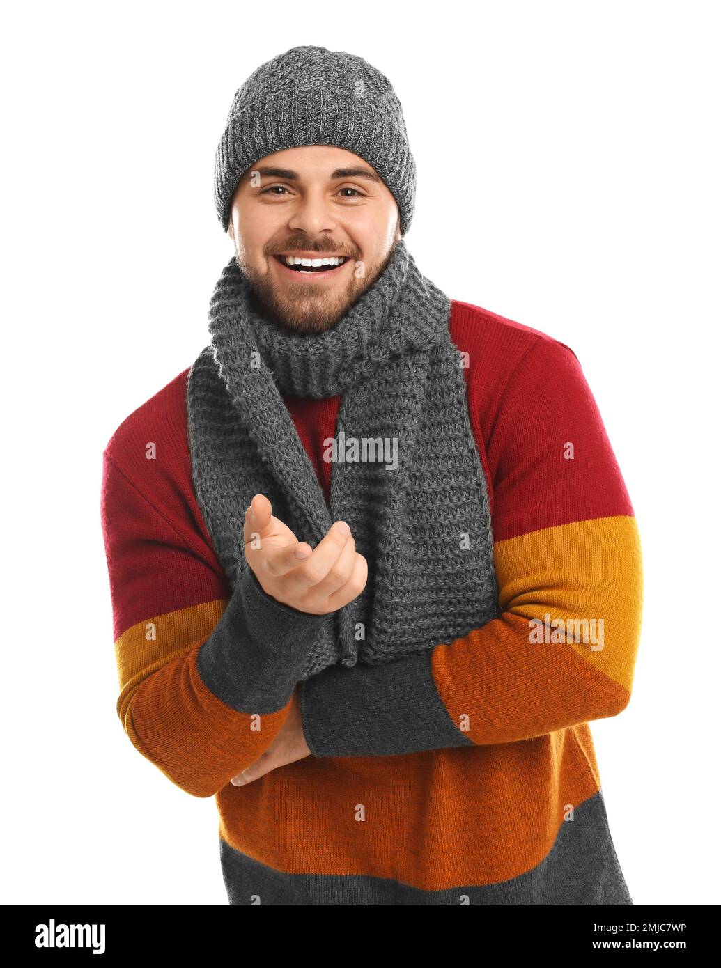 Emotional young man in warm clothes on white background. Winter ...