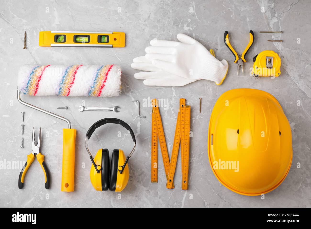 Flat lay composition with different construction tools on marble ...
