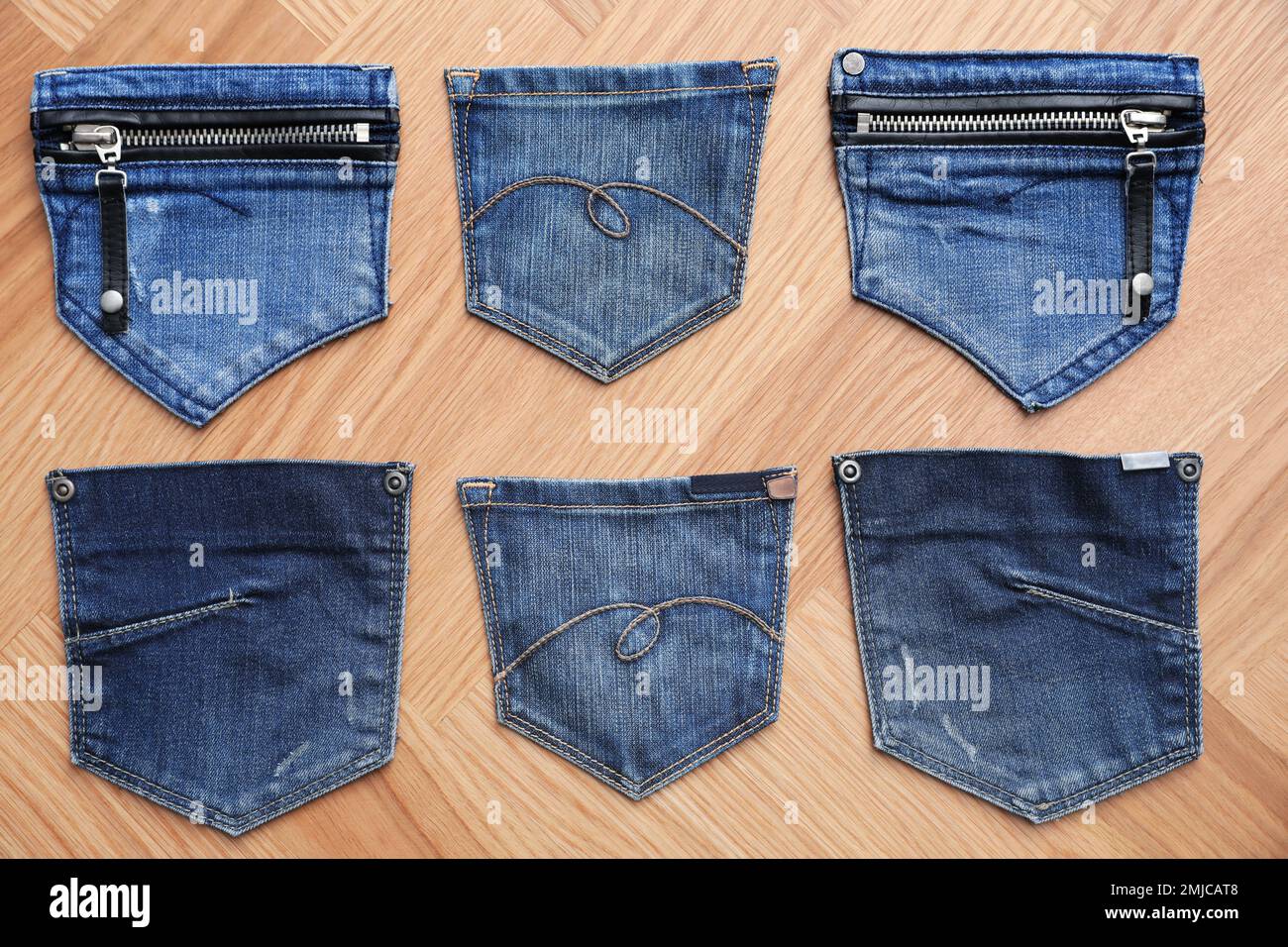 Flat lay composition with jeans pockets on table Stock Photo - Alamy