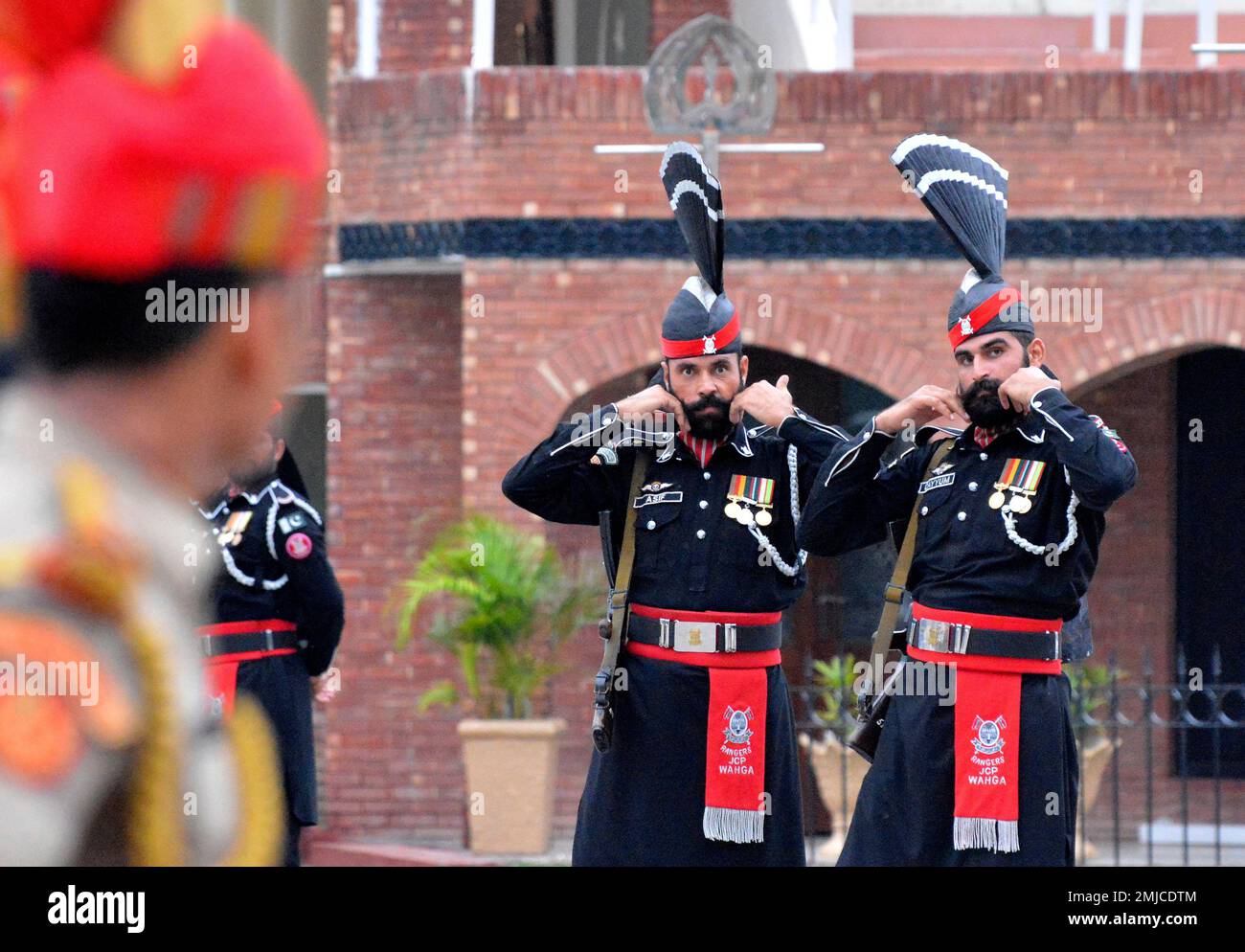 In this Aug. 9, 2019, photo, Pakistan Rangers soldiers face Indian ...