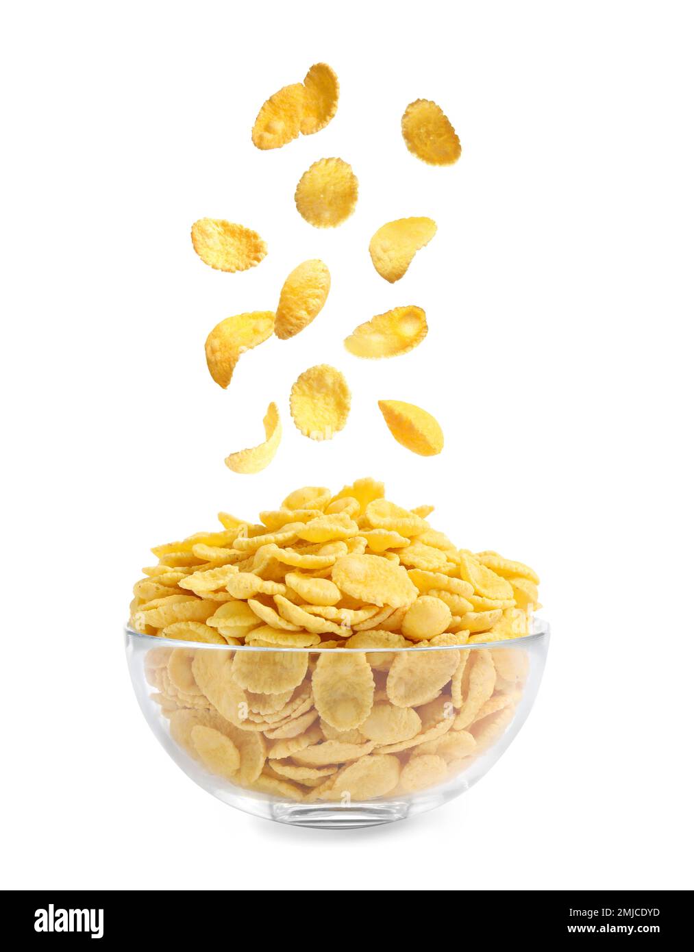 Tasty crispy corn flakes falling into bowl on white background Stock ...