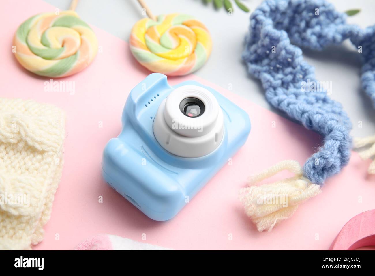 Light blue toy camera on color background. Future photographer Stock ...