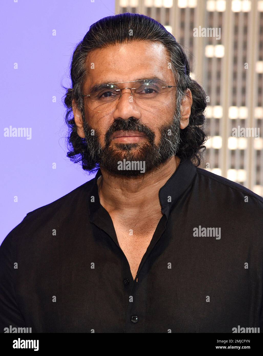 Indian actor Suniel Shetty participates in the ceremonial lighting of ...