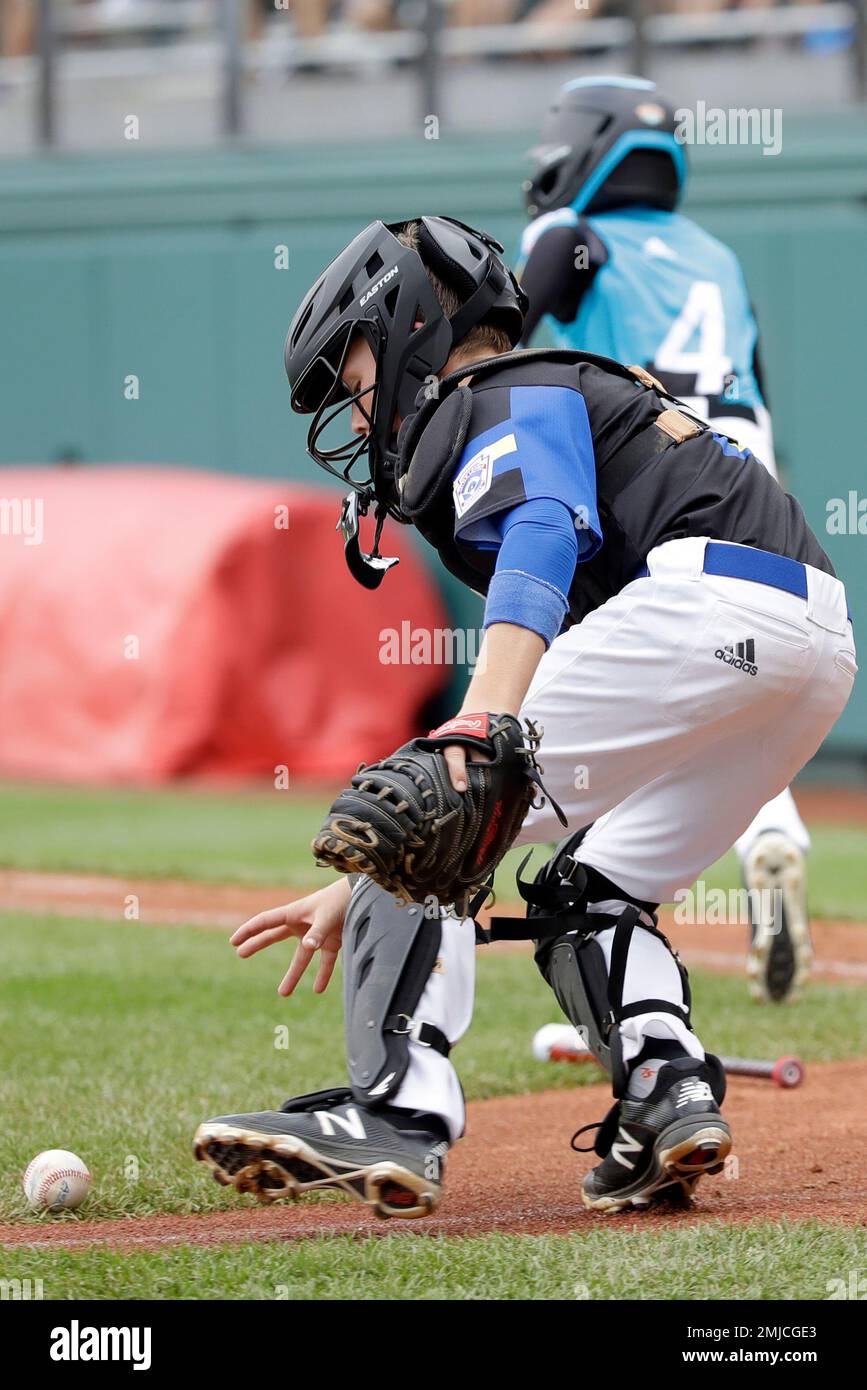 Australia's catcher Sam Levick (8) fields a bunt by Curacao's I-Zion ...
