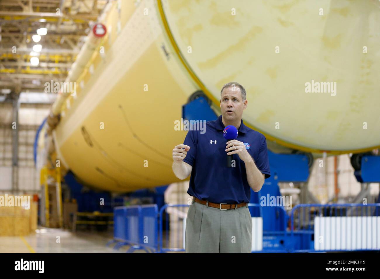 NASA Administrator Jim Bridenstine talks to reporters in front of the ...
