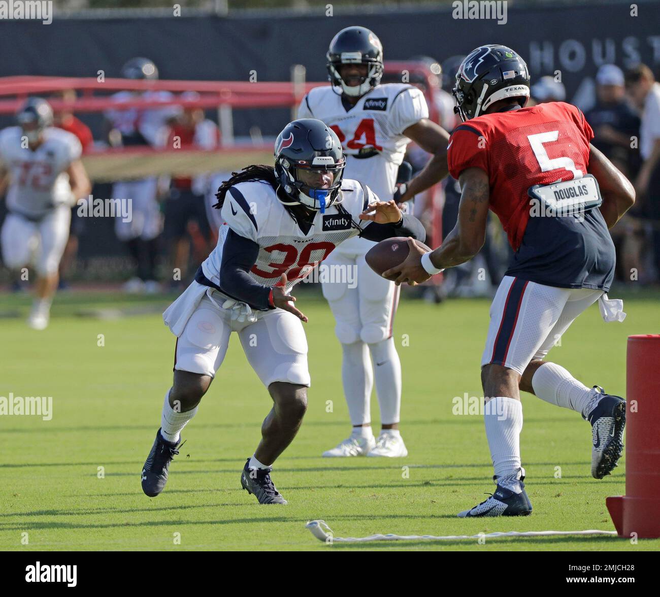 Houston Texans quarterback Joe Webb (5) hands the ball off to running ...