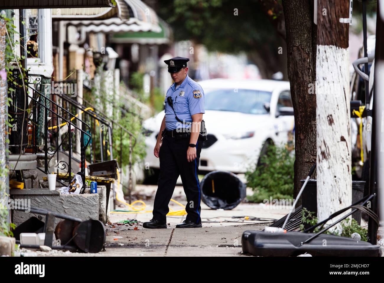 A Police Officer Stands Guard At The Scene Of Wednesdays Hourslong