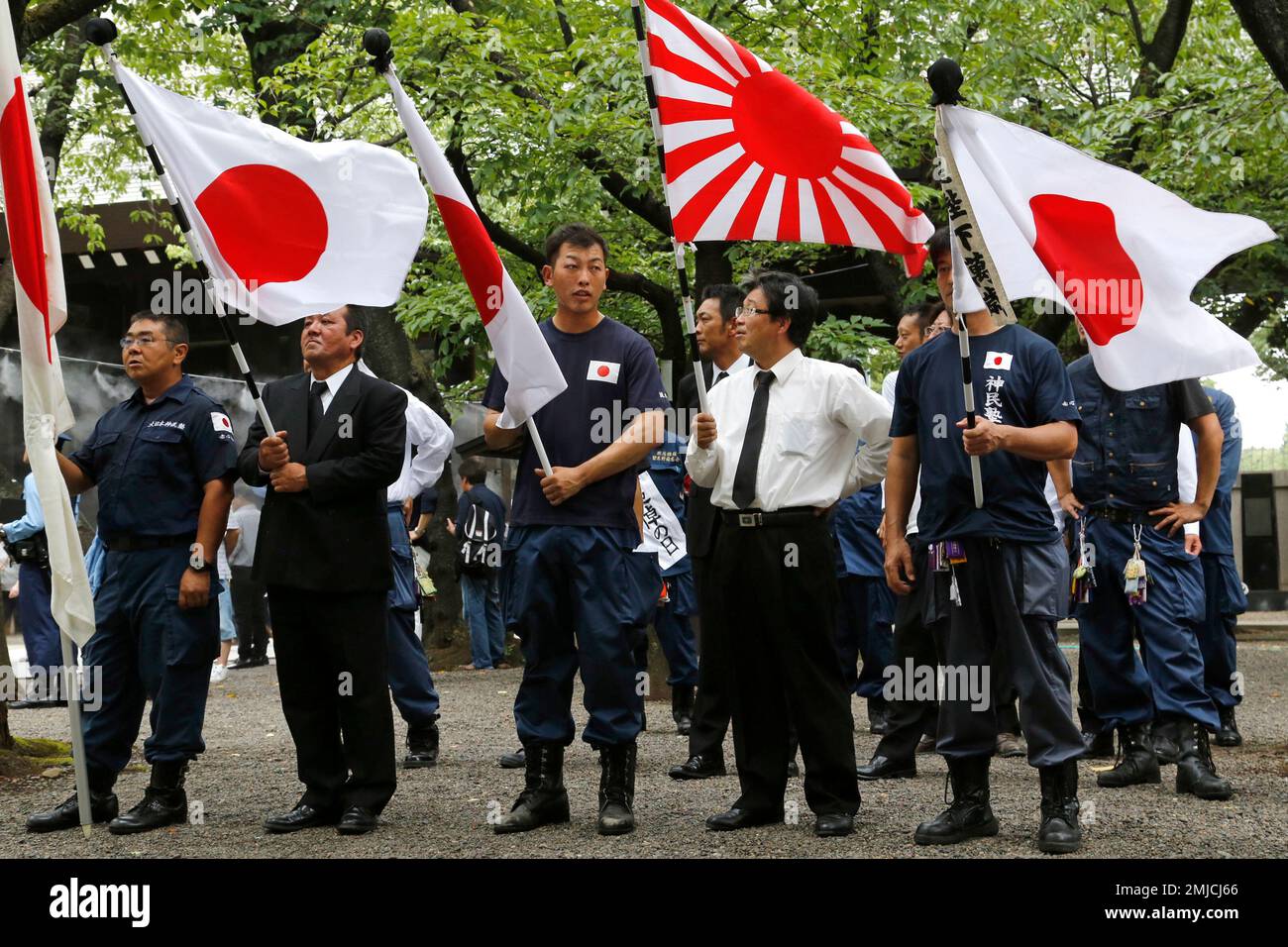 Members of a right wing group, holding national flag and Rising Sun ...