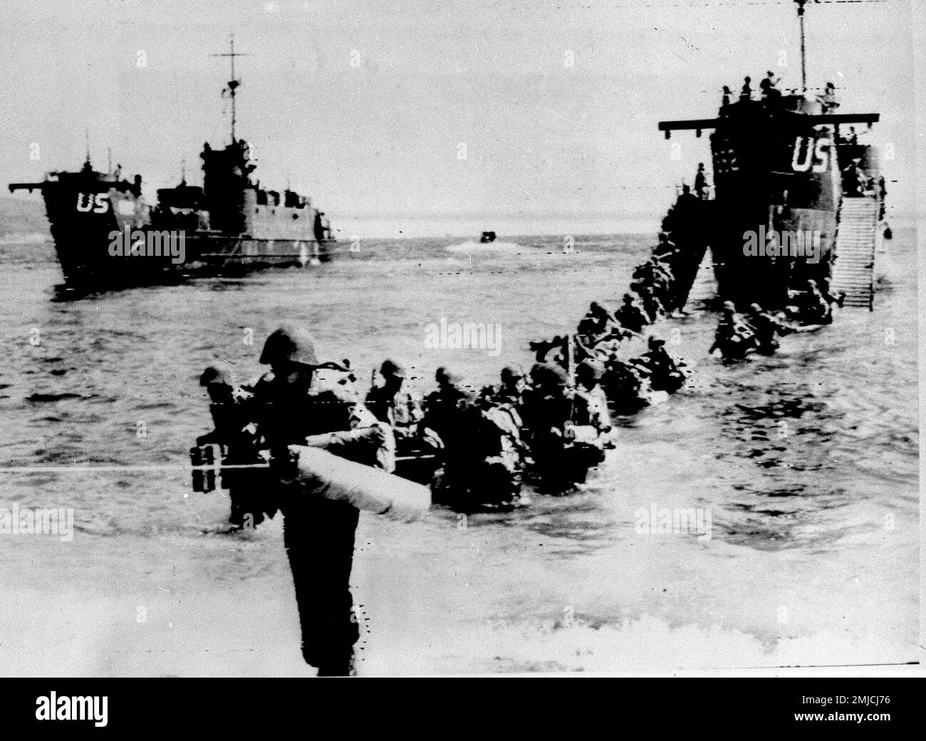 FILE - In this Aug 16, 1944 file photo, American and allied troops wade ...