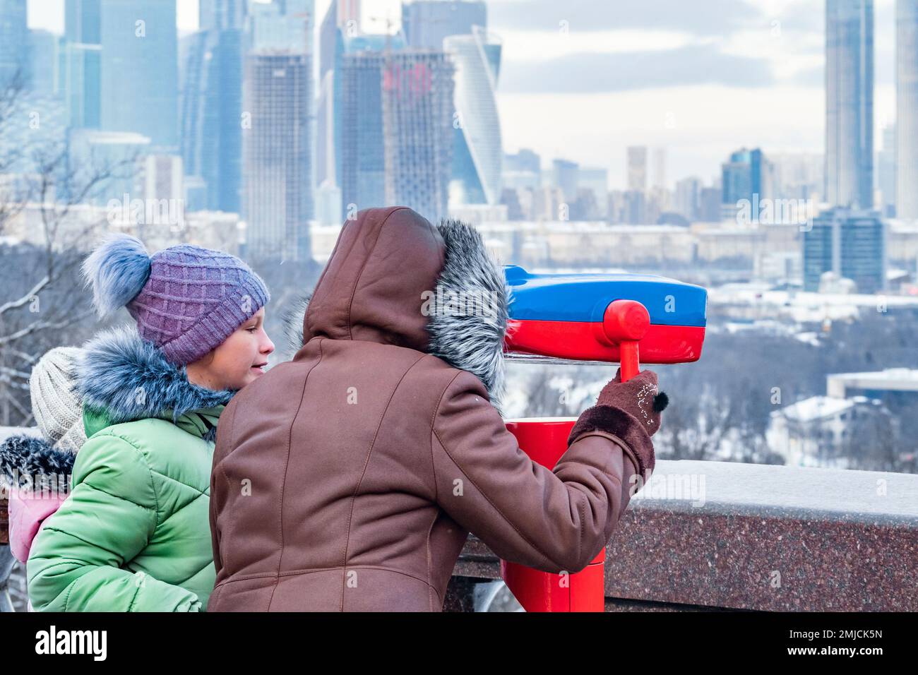 Russia, Moscow. People are seen on an observation deck on Vorobyovy ...