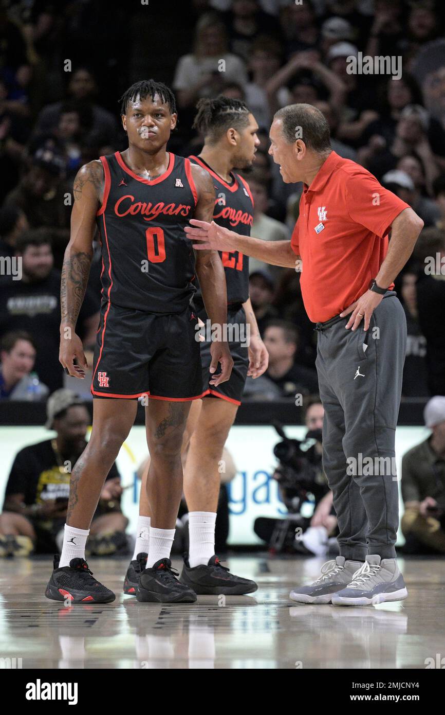 Houston head coach Kelvin Sampson, right, talks with guard Marcus ...