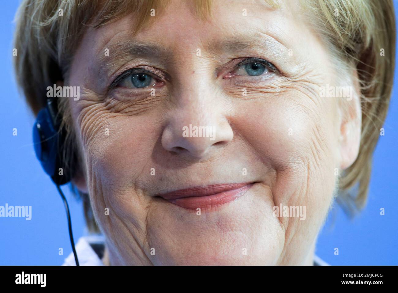German Chancellor Angela Merkel smiles as she attends a joint news ...
