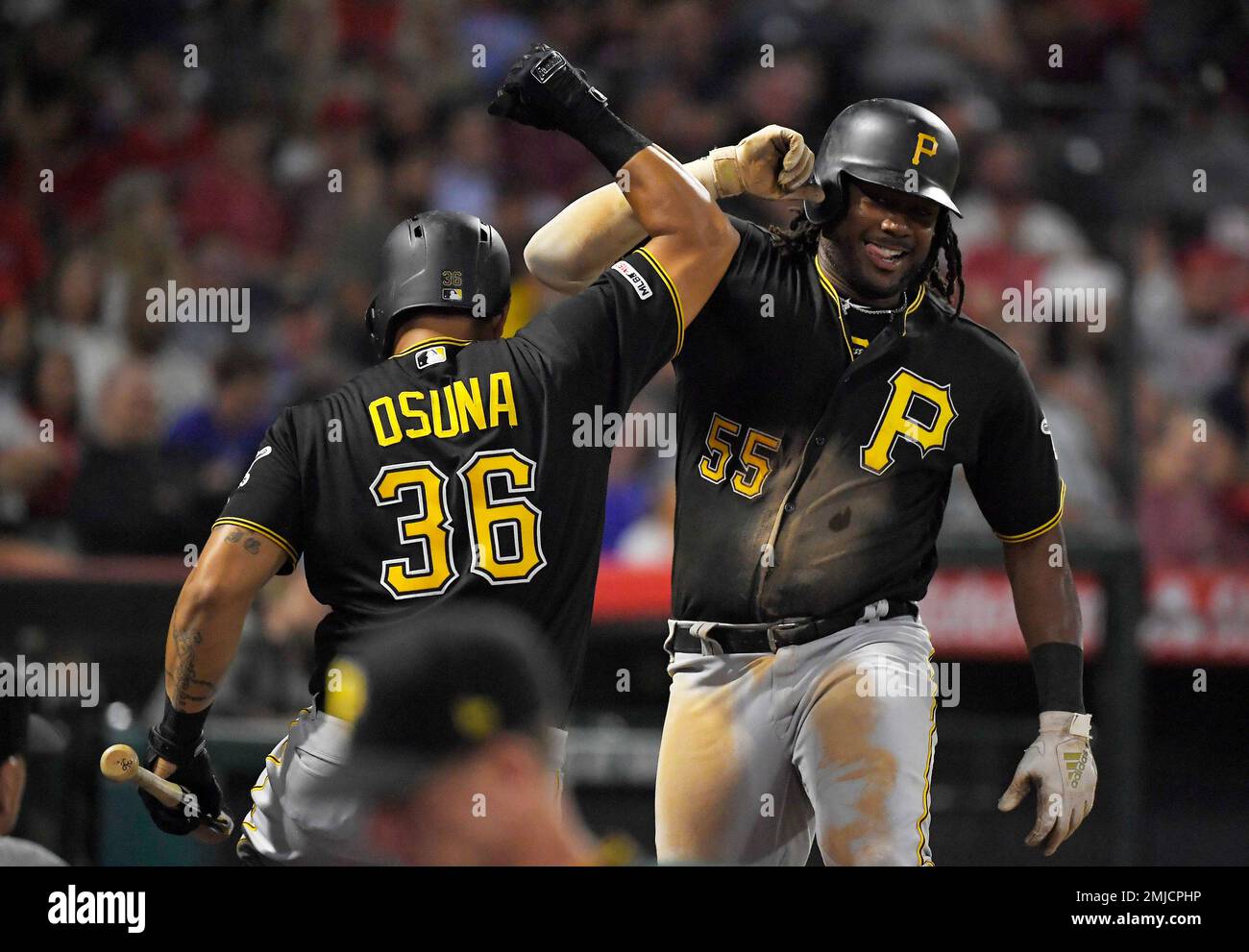 Pittsburgh Pirates' Josh Bell, right, is congratulated by Jose Osuna ...