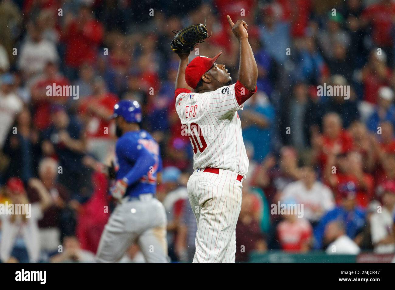 Philadelphia Phillies relief pitcher Hector Neris, right, reacts after ...
