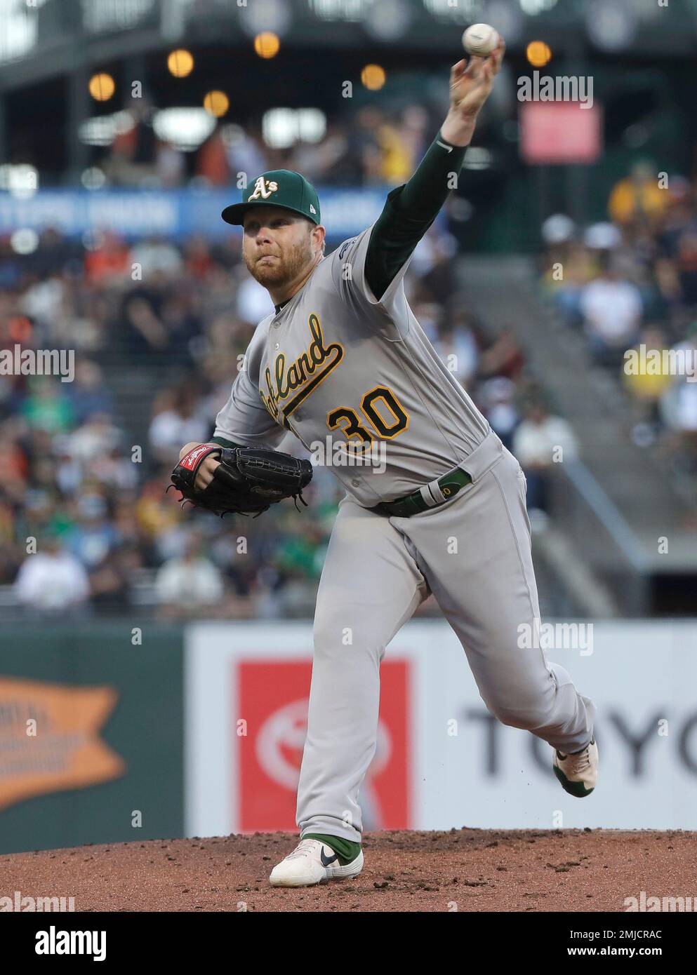 Oakland Athletics pitcher Brett Anderson throws to a San Francisco ...