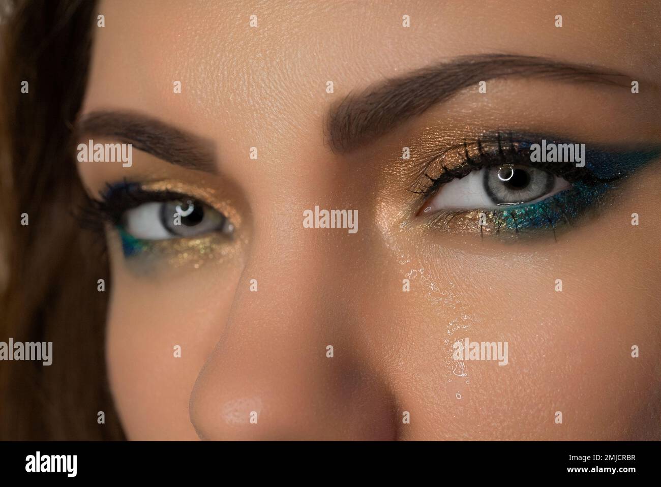 Ukrainian woman close-up, eyes crying, tears running down face.Pain,war ...