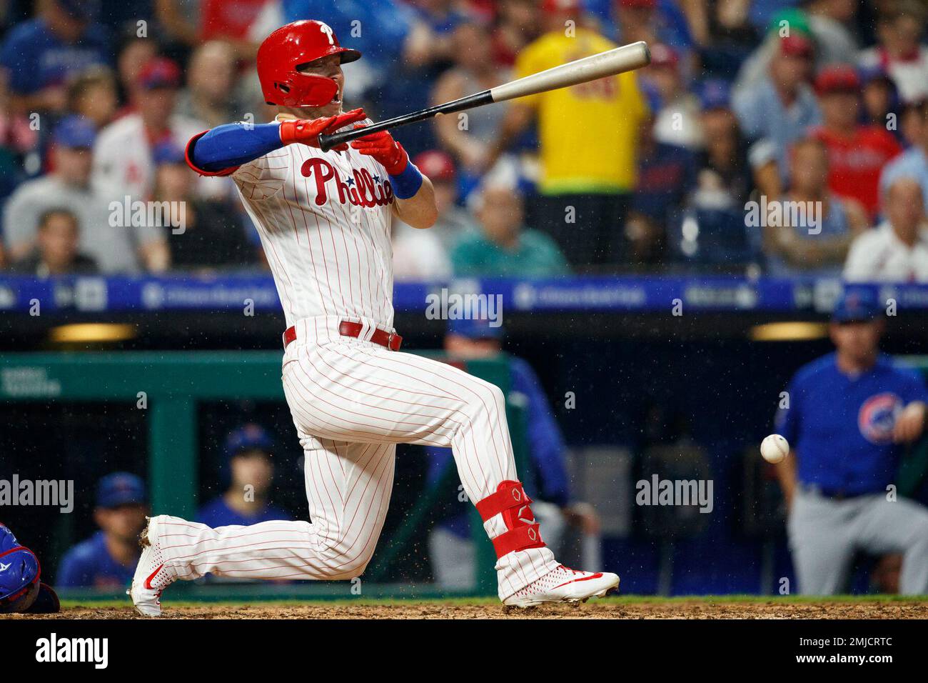 Philadelphia Phillies' Corey Dickerson reacts after being hit by a ...