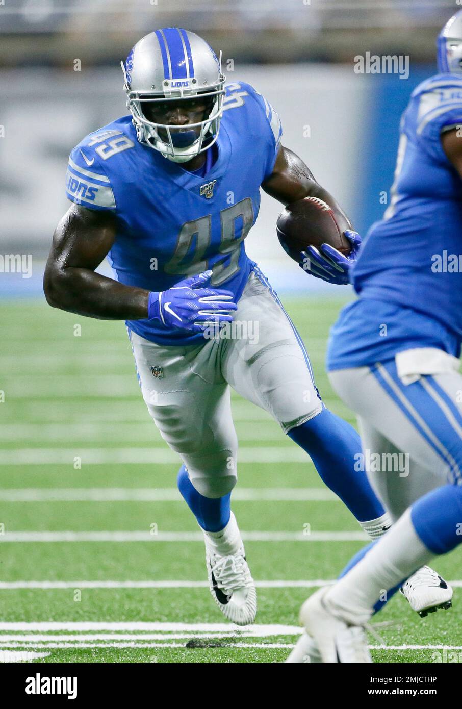 Detroit Lions running back Mark Thompson (49) carries the ball against ...