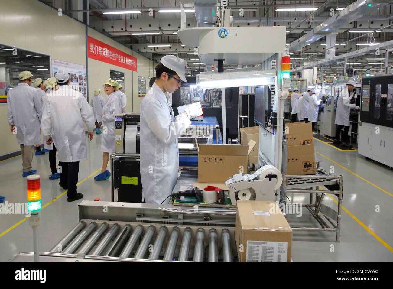 FILE - In this March 6, 2019, file photo a staff member works on a ...