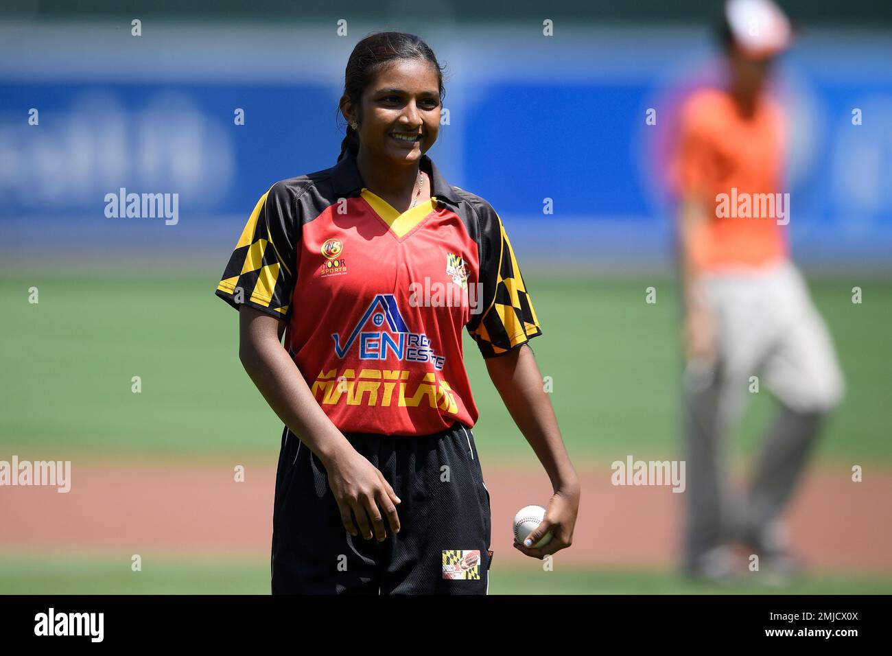 Cricket player Lisa Ramjit stands on the field before throwing out the ...