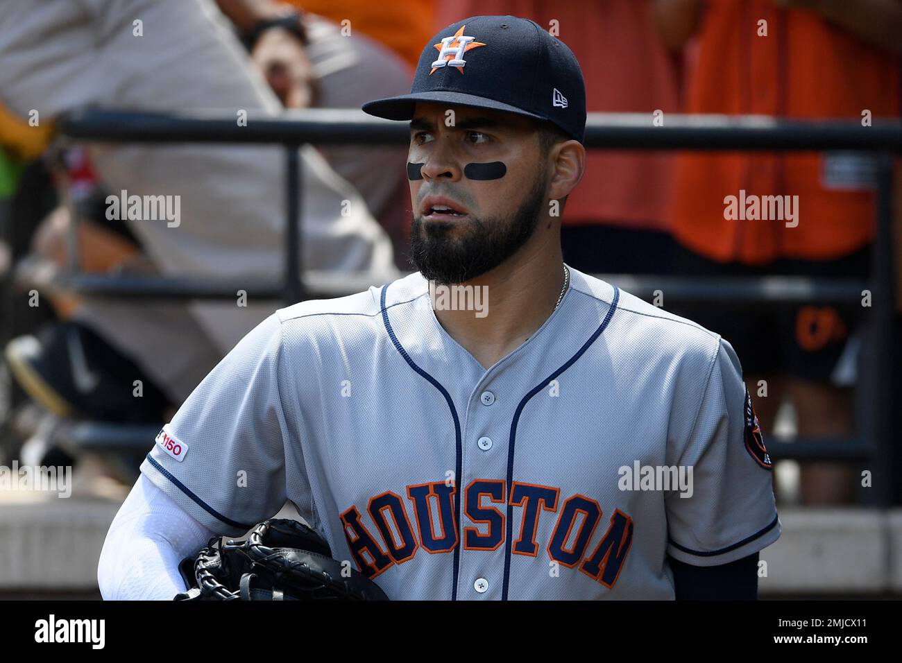 Houston Astros' Robinson Chirinos walks in the dugout before a baseball ...