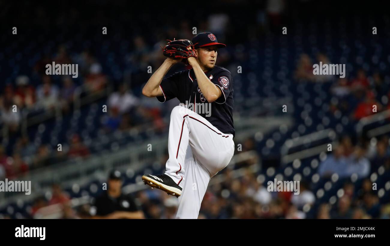Washington Nationals starting pitcher Erick Fedde (23) throws during a ...