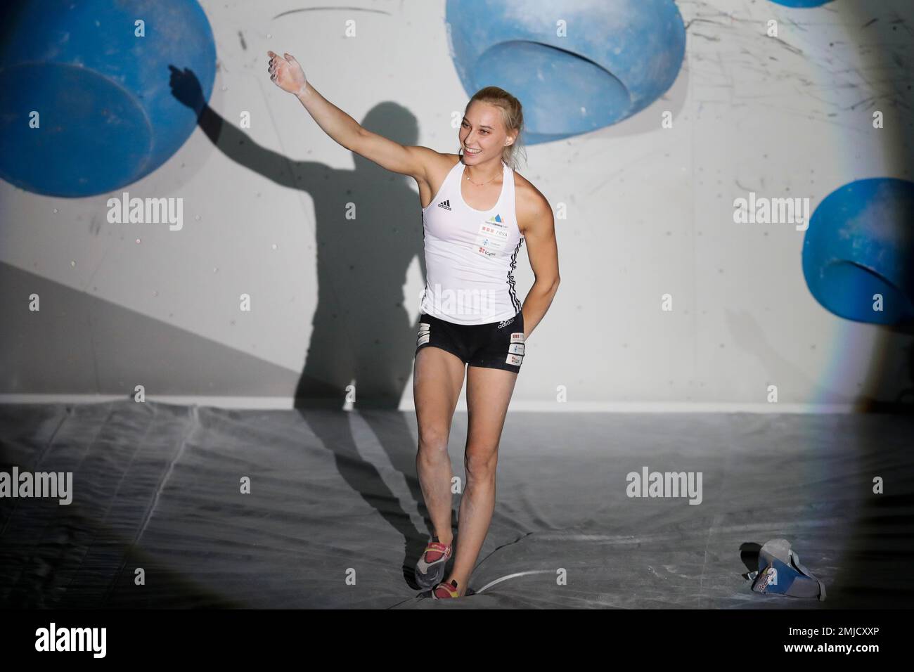 Janja Garnbret, of Slovenia, celebrates after completing a boulder ...