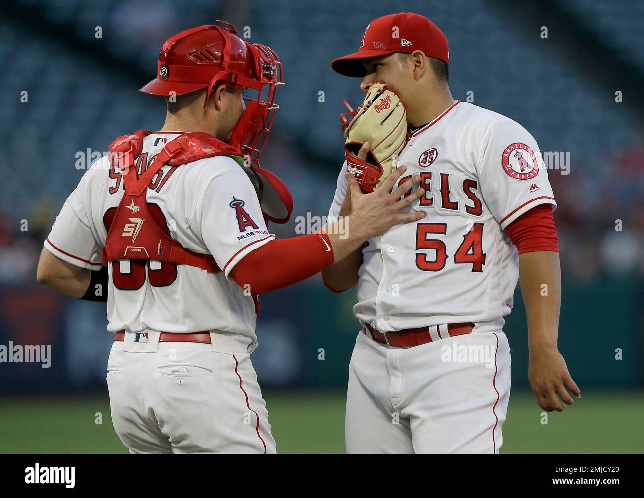 Los Angeles Angels catcher Max Stassi, left, talks with starting ...