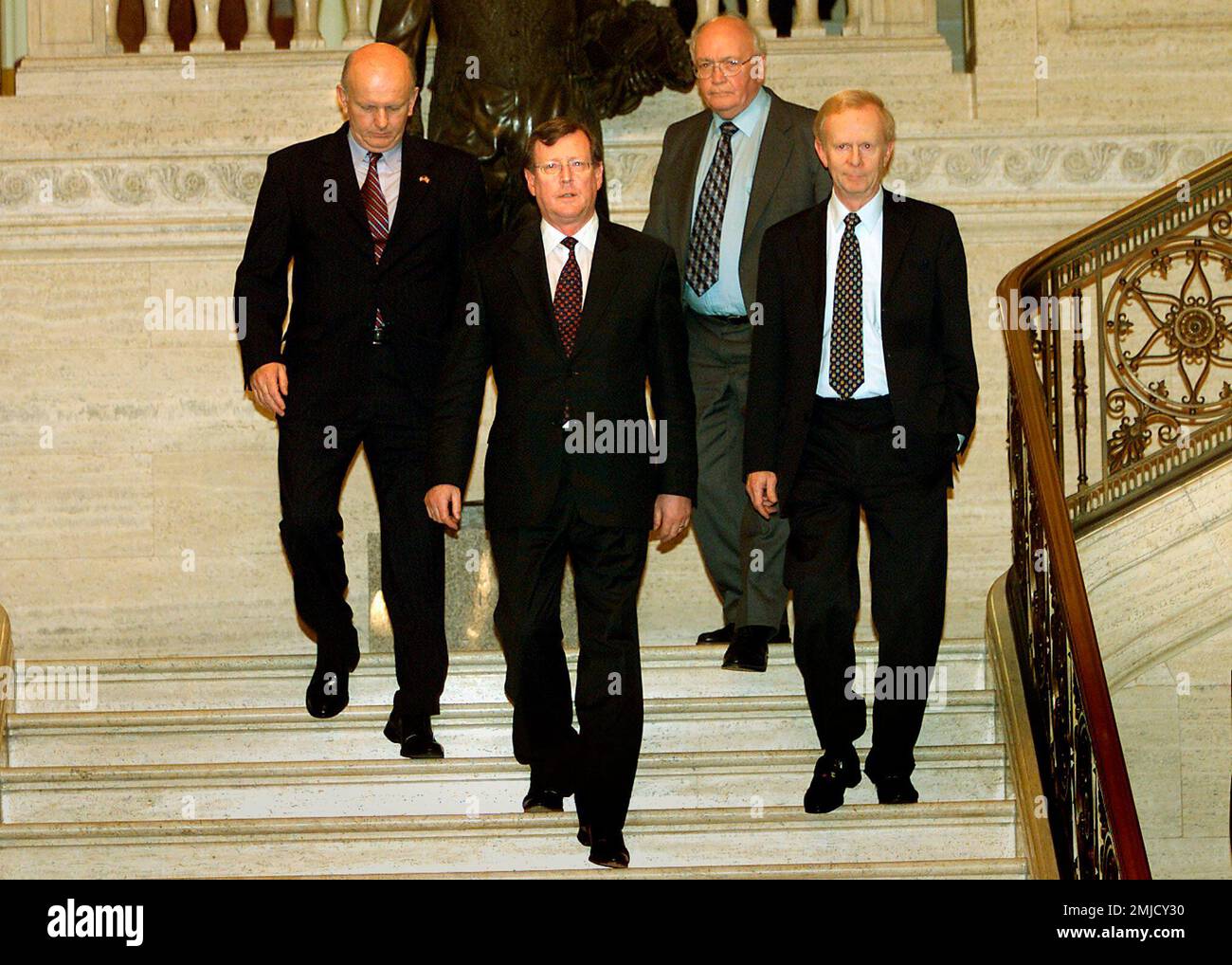 Ulster Unionist leader David Trimble, centre, leads his ministers from ...
