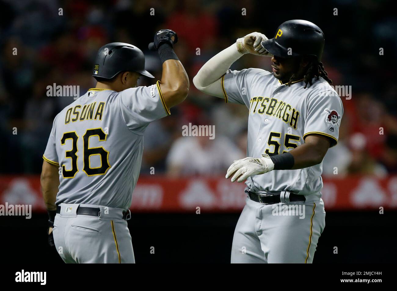 Pittsburgh Pirates' Jose Osuna, left, congratulates Josh Bell for ...