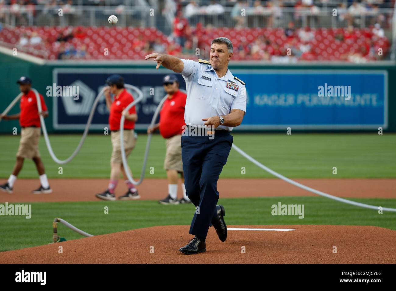 U.S. Coast Guard Commandant Adm. Karl Schultz throws out a ceremonial ...