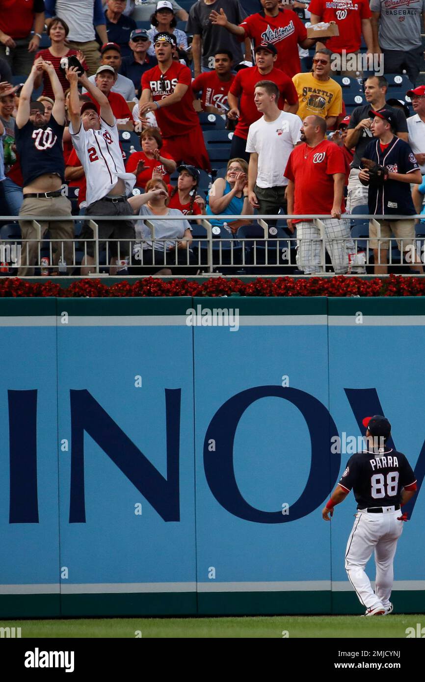 Washington Nationals left fielder Gerardo Parra (88) watches a fan ...