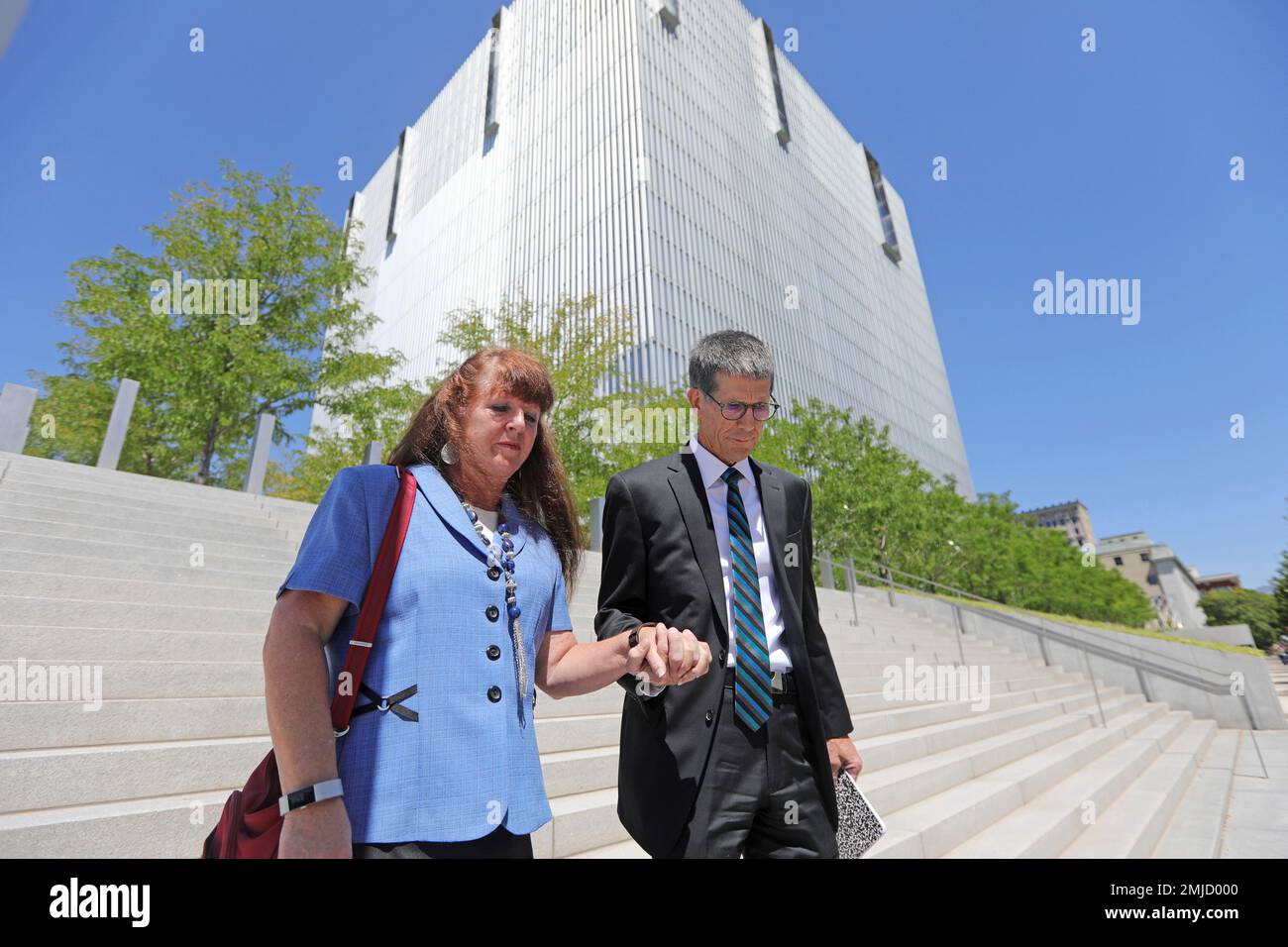 Mike and Becky Shamo, the parents of Aaron Shamo, walk from the federal ...