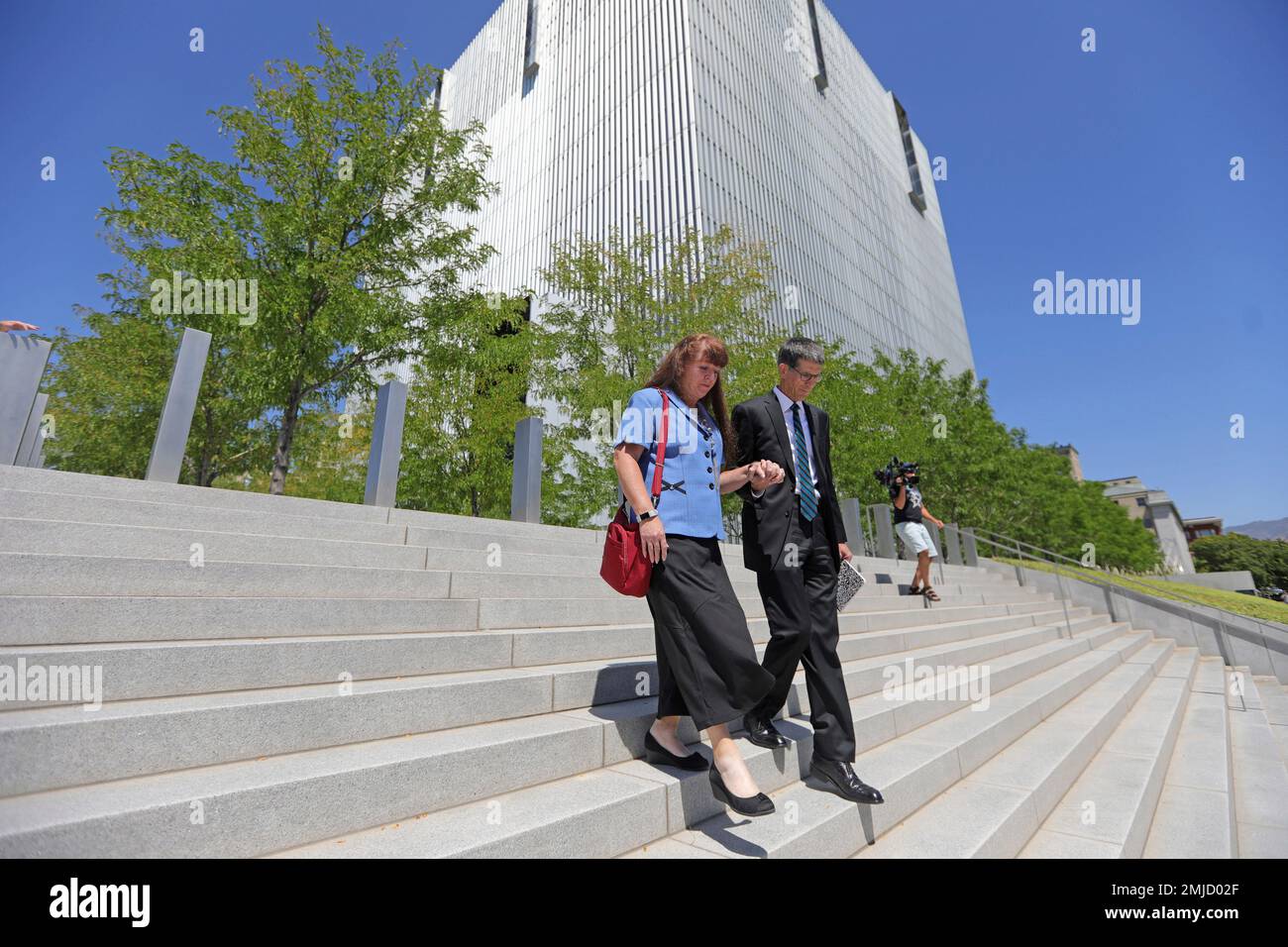 Mike and Becky Shamo, the parents of Aaron Shamo, walk from the federal ...