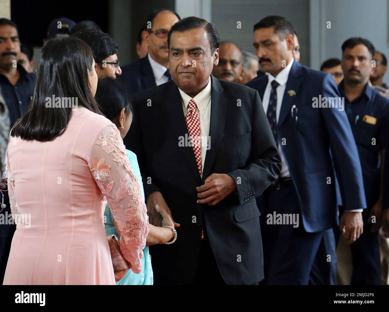 Chairman of Reliance Industries Limited Mukesh Ambani, center, arrives for the Annual General ...