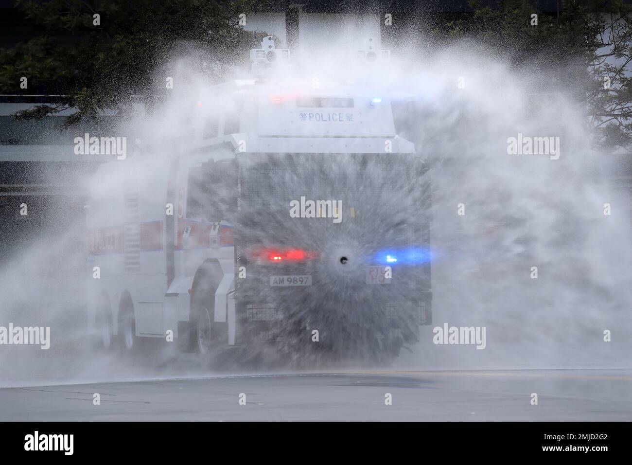 An anti-riot vehicle equipped with water cannon shows its water ...