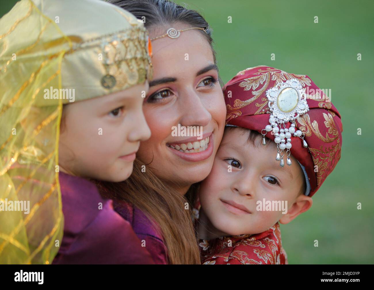 Children wearing traditional Turkish outfits pose for a picture ...
