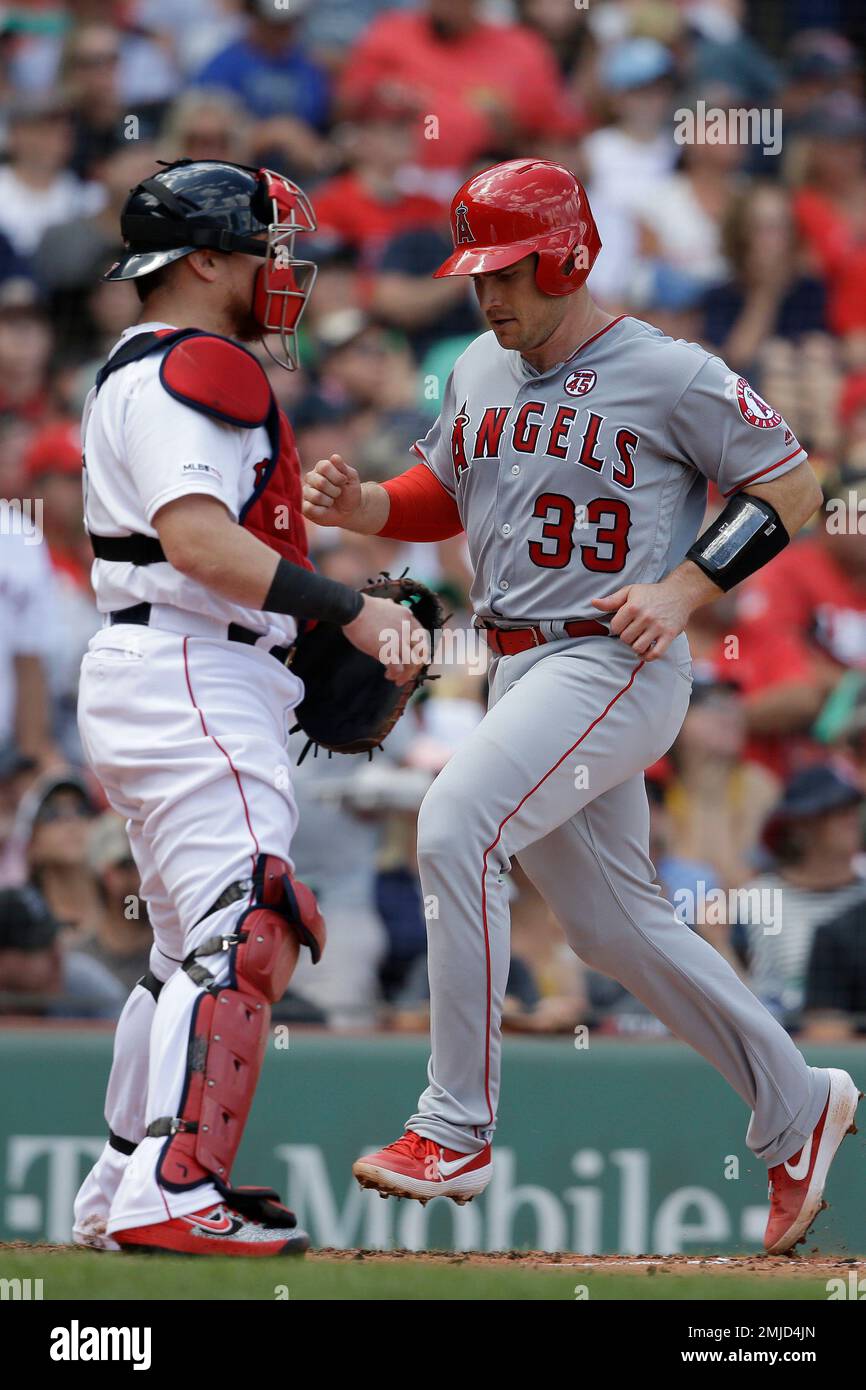Los Angeles Angels' Max Stassi (33) scores on a hit by Shohei Ohtani as ...