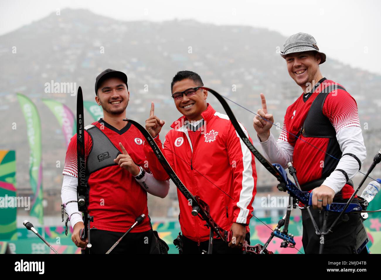 Canada's Eric Peters, left, Crispin Duenas, center, and Brian Maxwell pose for photos after ...
