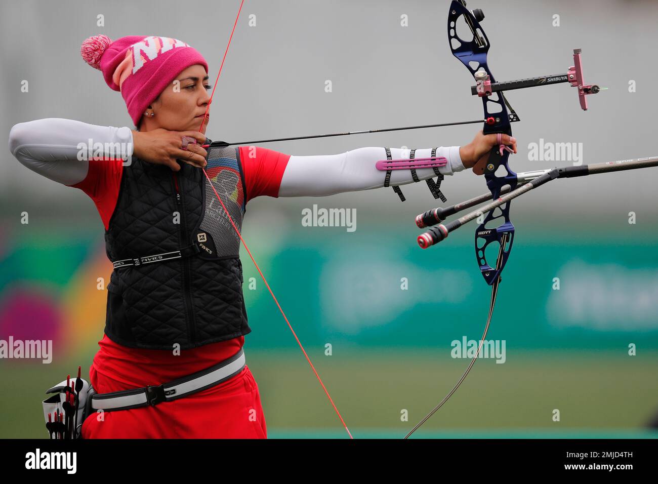 Mexico's Aida Roman aims her bow in women's archery recurve team gold ...
