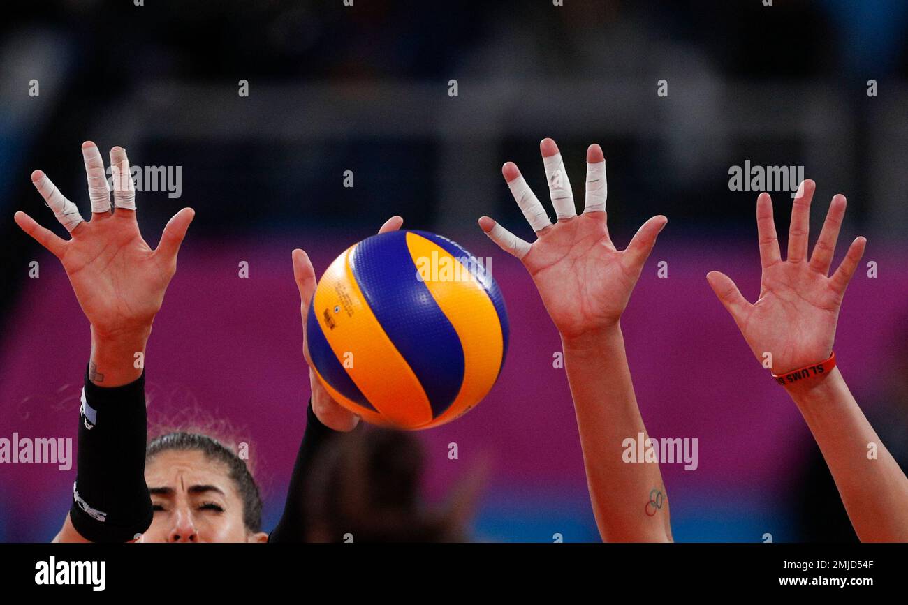 Argentina's Julieta Lazcano, left, and Paula Nizetich block a ball from ...