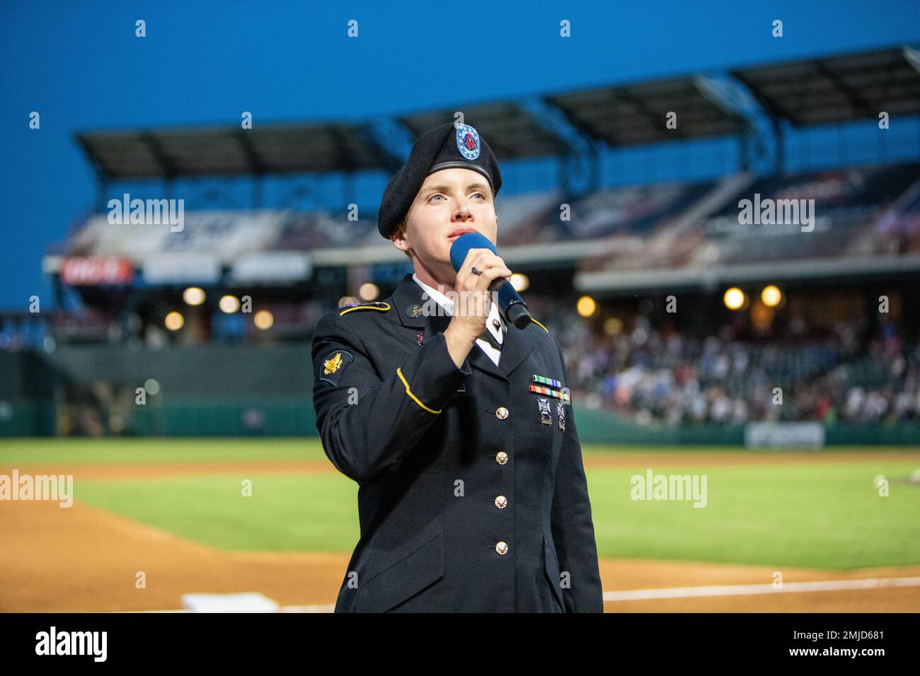 Spc. Brittany Simmons, a vocalist with the 77th Army Band, sings "God ...