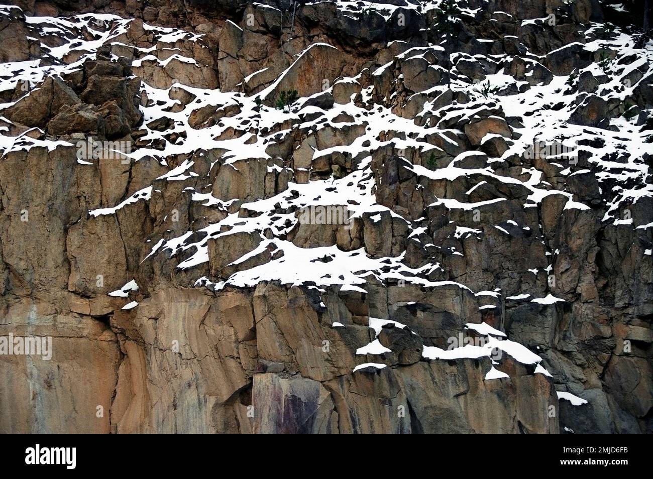 Rock face and snow in Yellowstone Park, US, fall Stock Photo - Alamy