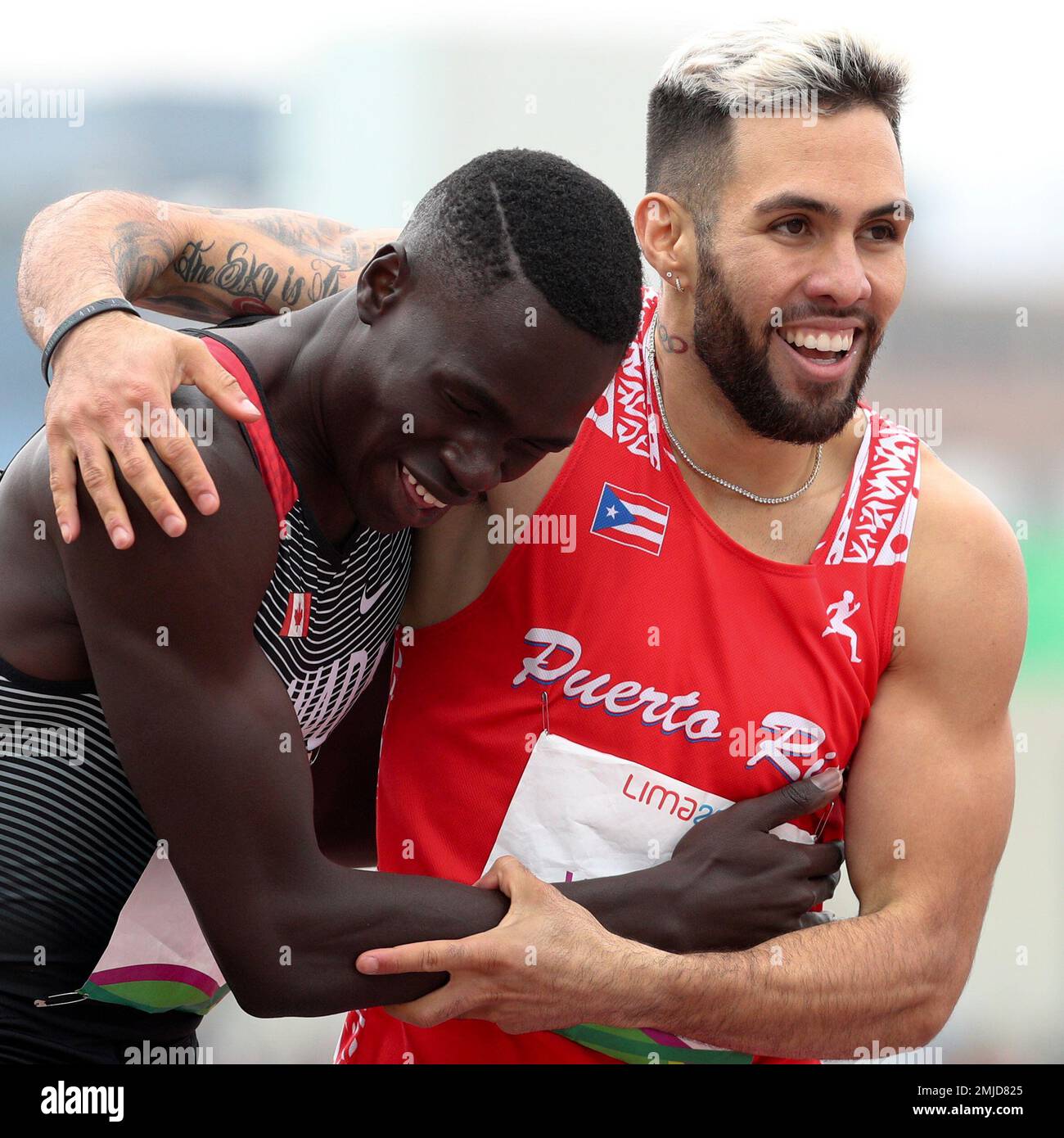 Silver medalist Wesley Vazquez ofPuerto Rico, right, embraces gold ...