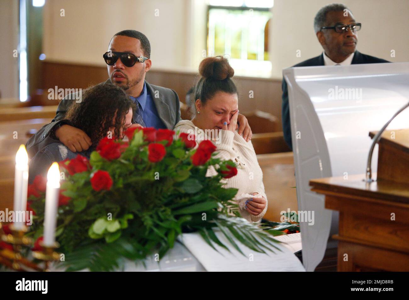 Friends and family mourn Derrick Fudge on Saturday, Aug. 10, 2019, at a ...
